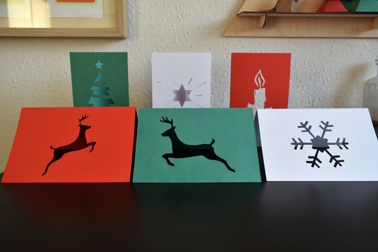 Wie kann man originelle Weihnachtskarten basteln mit Scherenschnitt?